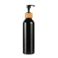 China Black Round Shoulder Cosmetic Lotion Bottle Bamboo PET Bottle 180ml 200ml 250ml 300ml for sale