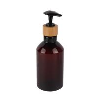 China 7oz 10oz 16oz Cosmetic Lotion Bottle Refillable Amber Slanted Shoulder PET Lotion Bottle for sale