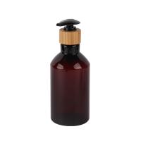 China 7oz 10oz 16oz Cosmetic Lotion Bottle Refillable Amber Slanted Shoulder PET Lotion Bottle for sale