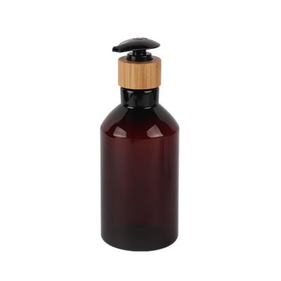 China 7oz 10oz 16oz Cosmetic Lotion Bottle Refillable Amber Slanted Shoulder PET Lotion Bottle for sale