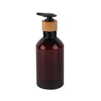 China 7oz 10oz 16oz Cosmetic Lotion Bottle Refillable Amber Slanted Shoulder PET Lotion Bottle for sale
