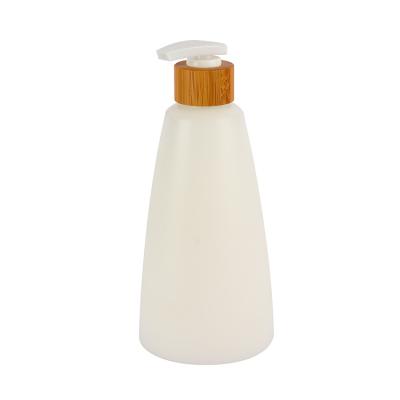 China 200ml 300ml 500ml 7oz 10oz 16oz Refillable Conical HDPE Lotion Bottle With Natural Bamboo for sale