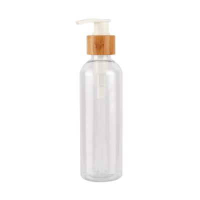 China Refillable Round Shoulder PET Bottle Natural Bamboo Lotion Pump 7oz 8oz 10oz 16oz for sale