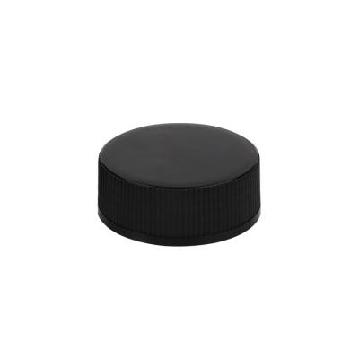 China 32/400 Black Ribbed Plastic Screw On Cap Sealed Rotating Cap For Cosmetic Packaging for sale