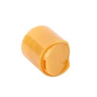 China Golden Yellow Smooth Disc Top Cap Press Type PP Plastic Flip Top Caps For Cream for sale