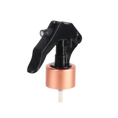 China 24/410 Black Plastic Mini Fine Mist Trigger Sprayer Rose Gold Aluminum Capped for sale