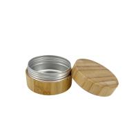 China Luxury Skincare Body Lotion Container Cylindrical Aluminum Cream Can With Bamboo Casings for sale