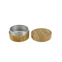China Luxury Skincare Body Lotion Container Cylindrical Aluminum Cream Can With Bamboo Casings for sale