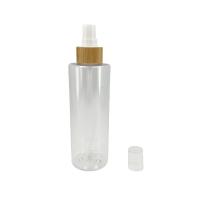 China Round Flat Shoulder Transparent Plastic Perfume Spray Bottles With Bamboo Lids 100ml 120ml for sale