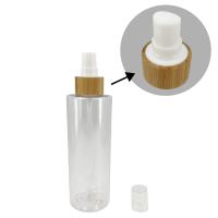 China Round Flat Shoulder Transparent Plastic Perfume Spray Bottles With Bamboo Lids 100ml 120ml for sale