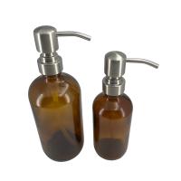 China Luxury 8oz 16oz Glass Clear Amber Boston Round Pump Bottles For Hand Lotion Shampoo for sale