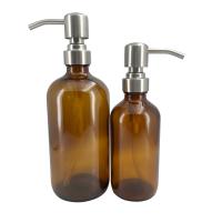 China Luxury 8oz 16oz Glass Clear Amber Boston Round Pump Bottles For Hand Lotion Shampoo for sale