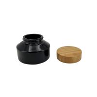 China Black Glass Cosmetic Cream Jar With Bamboo Lid 30ml 50ml Facial Cream Containers for sale