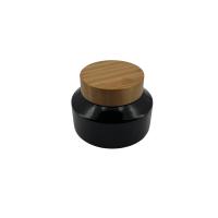 China Black Glass Cosmetic Cream Jar With Bamboo Lid 30ml 50ml Facial Cream Containers for sale