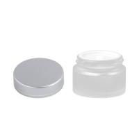 China Round 20g Cosmetic Cream Jar Transparent Frosted Glass Cream Jar With Silver Plastic Lid for sale