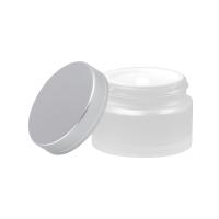 China Round 20g Cosmetic Cream Jar Transparent Frosted Glass Cream Jar With Silver Plastic Lid for sale