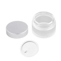 China Round 20g Cosmetic Cream Jar Transparent Frosted Glass Cream Jar With Silver Plastic Lid for sale