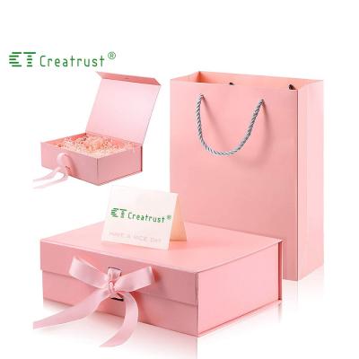 China SZCX Eco Friendly Custom Logo Gift Bags Matte Laminated Boutique Private Label Elegant Pink Paper Bag With Gold Ribbon for sale