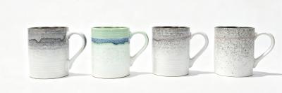 China Collection Overview This 4-piece  ceramic mug collection showcases unique handcrafted speckled reactive glaze with organic mottled texture covering the entire cup body, paired with a clean off for sale