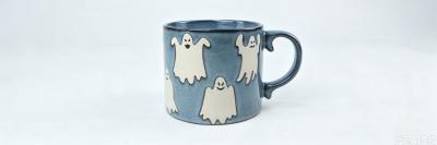 China Halloween Ghost Embossed Ceramic Mug, Blue Reactive Glaze Spooky Ghost Coffee Cup for sale