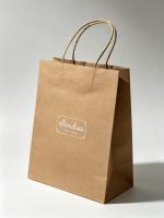 China Custom Kraft Paper Bag with Logo Printing Available in Various Sizes and Shapes Suitable for Retail Packaging Needs for sale