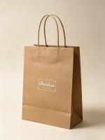 China Custom Kraft Paper Bag with Logo Printing Available in Various Sizes and Shapes Suitable for Retail Packaging Needs for sale