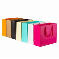 China Custom Printed Kraft Paper Bag Designed with Matte Glossy Lamination Varnish Spot UV Embossing and Foil Stamping for Packaging Applications for sale