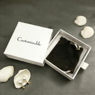 China Jewelry Paper Box customizable with logos hot stamping embossing and silver stamping made from thick rigid greyboard and art paper for sale