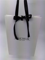 China Space saving foldable Recycled Gift Bags crafted from white art paper with customizable logo and ribbon color perfect for retail and gifting for sale