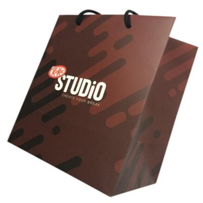 China Recycled Gift Bags Foldable Paper Shopping Bags with Black Twisted Rope Handles and Custom Size Options for Giveaways for sale