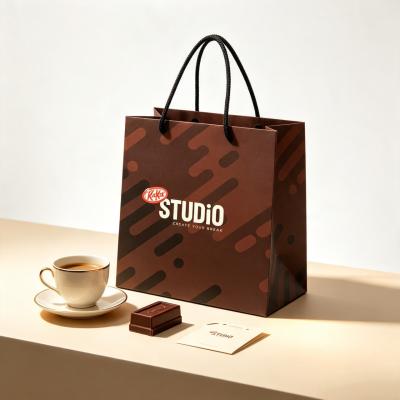China Recycled Gift Bags Foldable Paper Bags with Full Color CMYK Printing and Durable Rope Handles for Giveaways and Gift Sets for sale