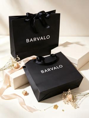 China Recycled Gift Bags Matte Black Paper Bags with Satin Ribbon Handles and Soft Touch Lamination for High End Gift Packaging for sale