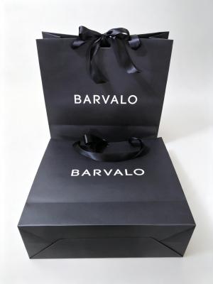 China Recycled Gift Bags Matte Black Paper Bags with Satin Ribbon Bow for Fashion Cosmetics Jewelry and Luxury Gift Packaging Needs for sale