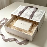 China Recycled Gift Bags with Rigid Cardboard Construction and Bamboo Leaf Embossed Printing Matched with Soft Grey Satin Ribbon Handle for sale