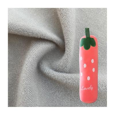 China Super Soft Polyester Velvet Fabric 105-180gsm Medium Weight Knitted Material 145-155cm Width for Doll Manufacturing for sale