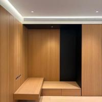 China Modern Minimalist Solid Wood Veneer Integrated Wall Panel & Concealed Full‑Height Cabinet for sale