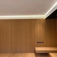 China Modern Minimalist Solid Wood Veneer Integrated Wall Panel & Concealed Full‑Height Cabinet for sale