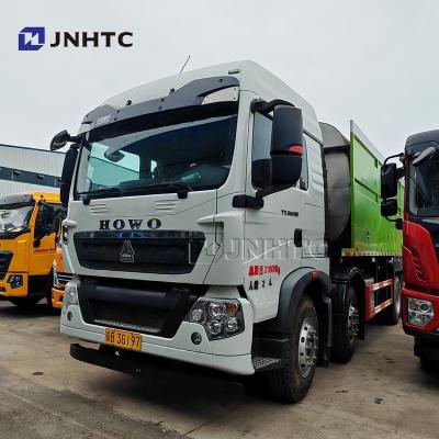 China HOWO 8X4 350HP 12 Wheel Dump Truck Chassis With Synchronous Gravel Sealing Truck for sale
