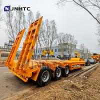 China Heavy Duty 60 80 Tons Lowbed Truck Semi Trailer With Leaf Spring Suspension System And Water Function for sale