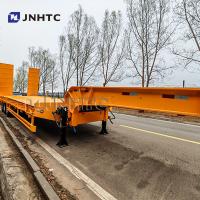 China Heavy Duty 60 80 Tons Lowbed Truck Semi Trailer With Leaf Spring Suspension System And Water Function for sale