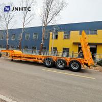 China Heavy Duty 60 80 Tons Lowbed Truck Semi Trailer With Leaf Spring Suspension System And Water Function for sale