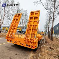 China Heavy Duty 60 80 Tons Lowbed Truck Semi Trailer With Leaf Spring Suspension System And Water Function for sale