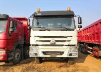 China 8x4 Driven 40 Ton Heavy Duty Dump Truck Howo 12 Wheel For 30 Cubic Cargo White Color for sale