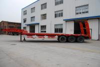 China 3 Axle Low Bed Semi Trailer Red Color With Self Steering Axles And Hydraulic Ramps for sale