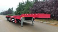 China 3 Axle Low Bed Semi Trailer Red Color With Self Steering Axles And Hydraulic Ramps for sale