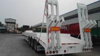 China 3 Axle Low Bed Semi Trailer Red Color With Self Steering Axles And Hydraulic Ramps for sale