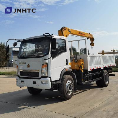 China Sinotruk Howo Homan 6 Wheel 4x2 Dropside Cargo Truck With 3.2t Crane for sale