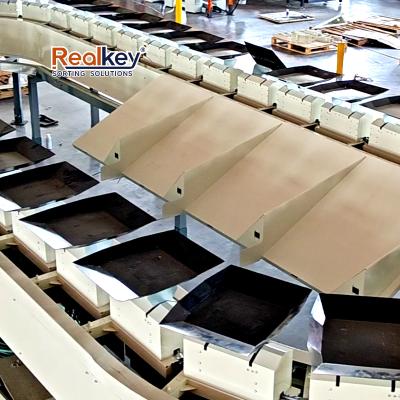 China High-Capacity 7200-10800p/h Tilt Tray Sorter with PLC Control and WMS Integration for Automated Sorting for sale