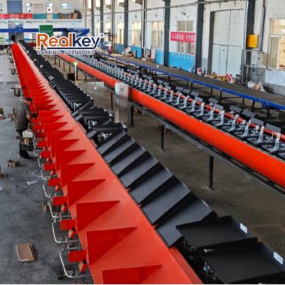 China Space Saving High Precision Tilt Tray Sorter 99.99% Accuracy, 7200-10800 p/h, 500mm Pitch for sale