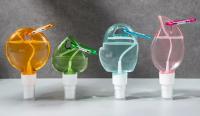 China Plastic 50ml Hand Sanitizer Bottle Keychain Hook Heart Shaped for sale